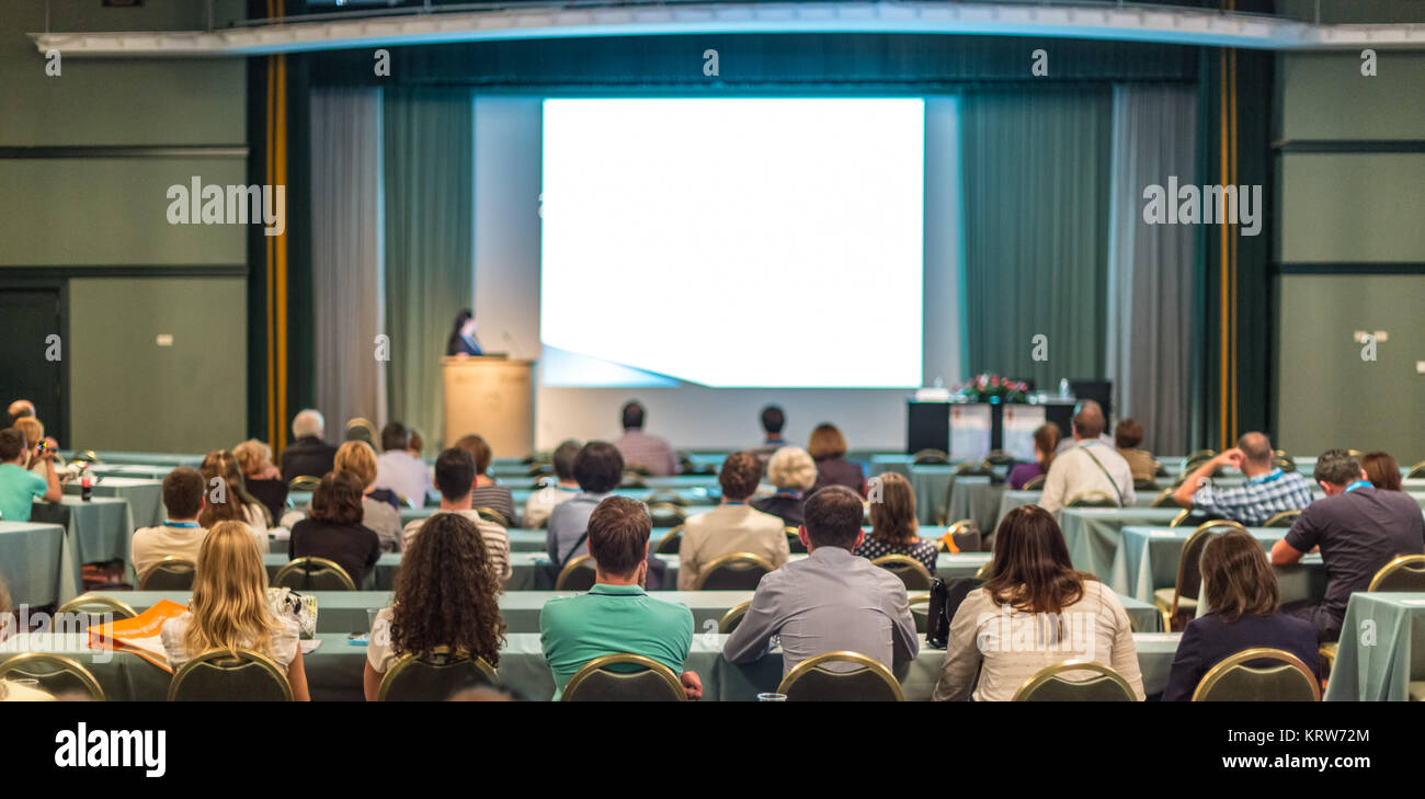 Audience in lecture hall participating at business conference Stock ...
