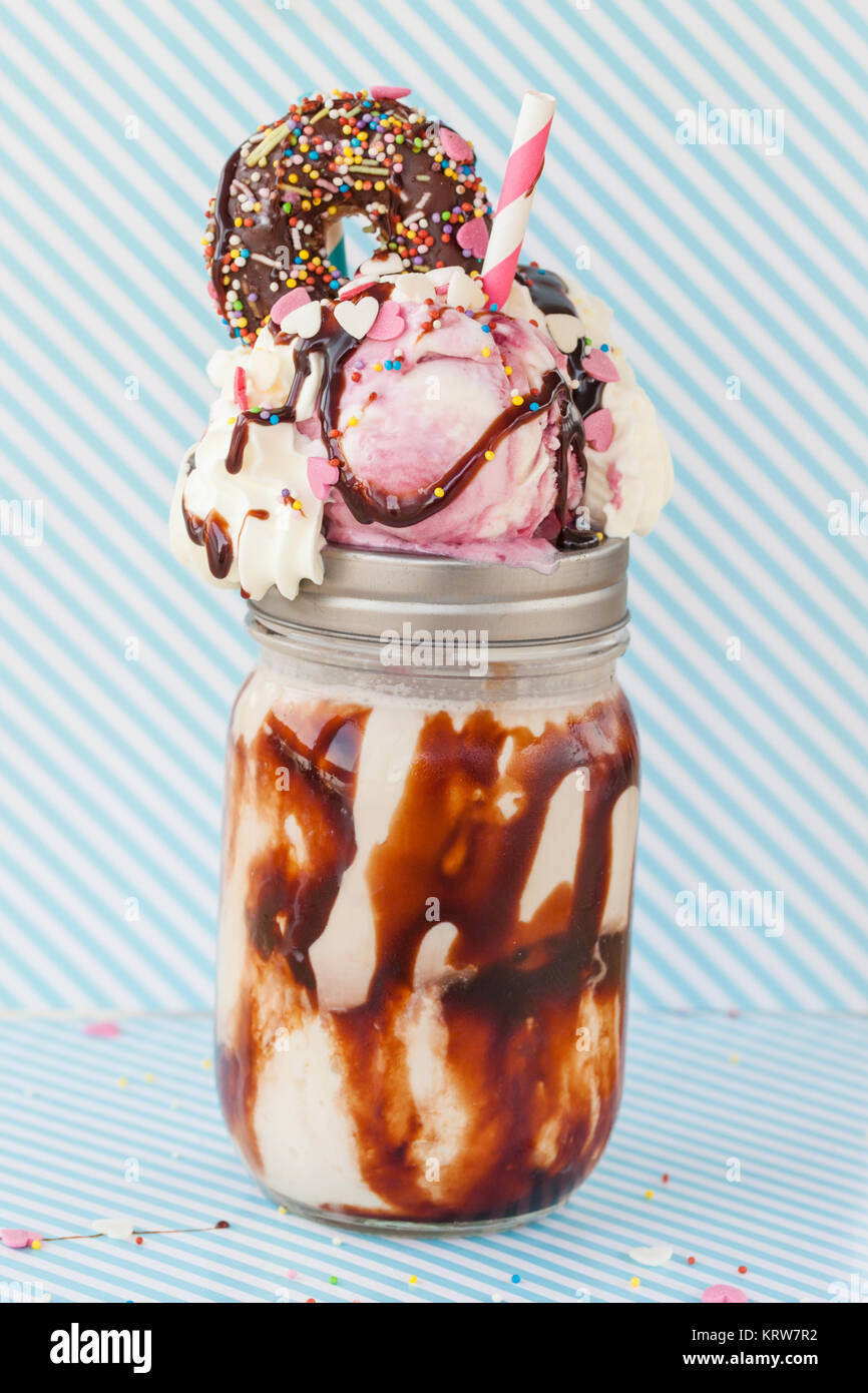 creamy milkshake with donut Stock Photo - Alamy