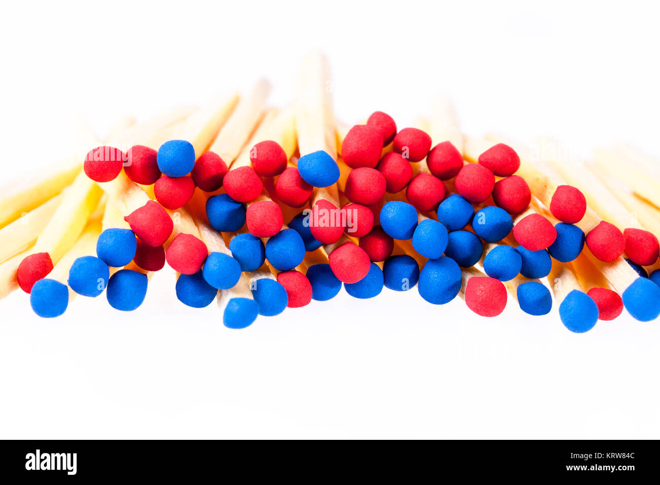 Heap of matches with red and blue heads isolated on white background ...