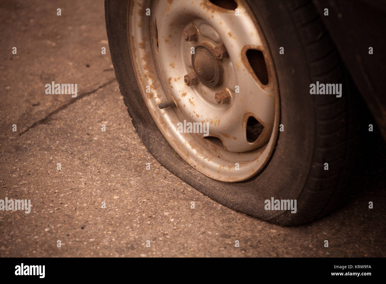 Car flat tire Stock Photo - Alamy
