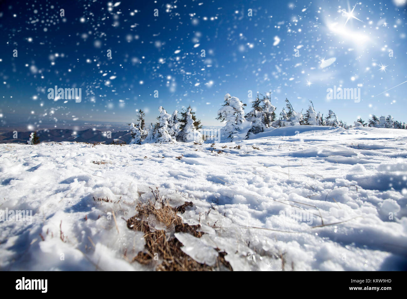 Winter landscape with snow covered hill and blue sky Stock Photo - Alamy