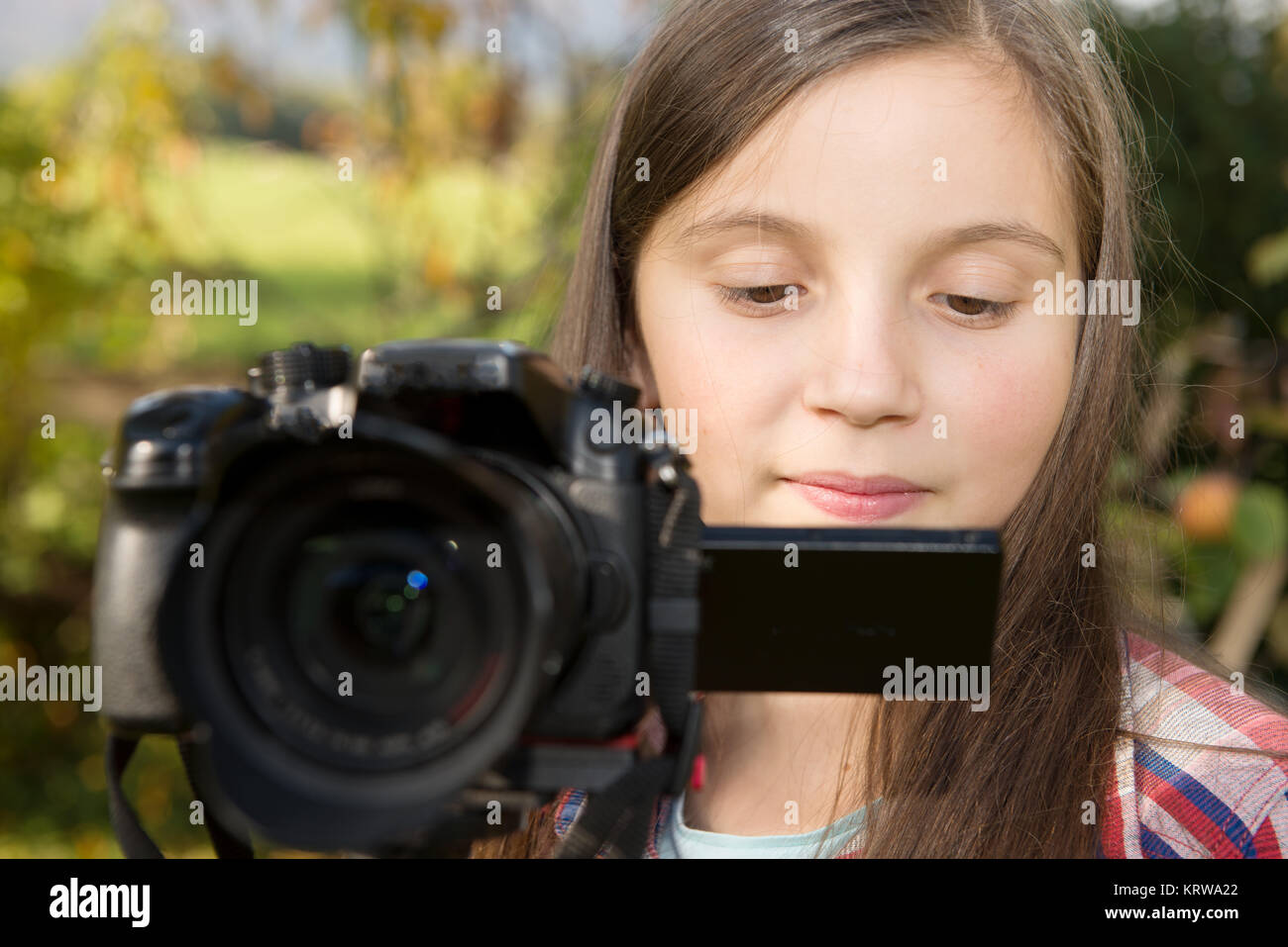 Teenage girl with a camera Stock Photo - Alamy