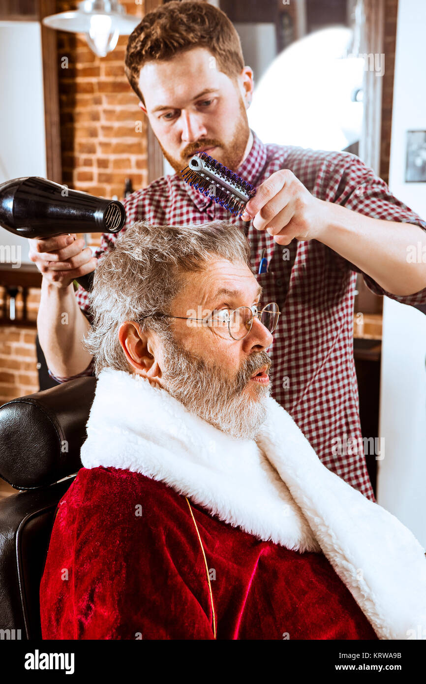 Santa claus shaving his personal barber Stock Photo - Alamy