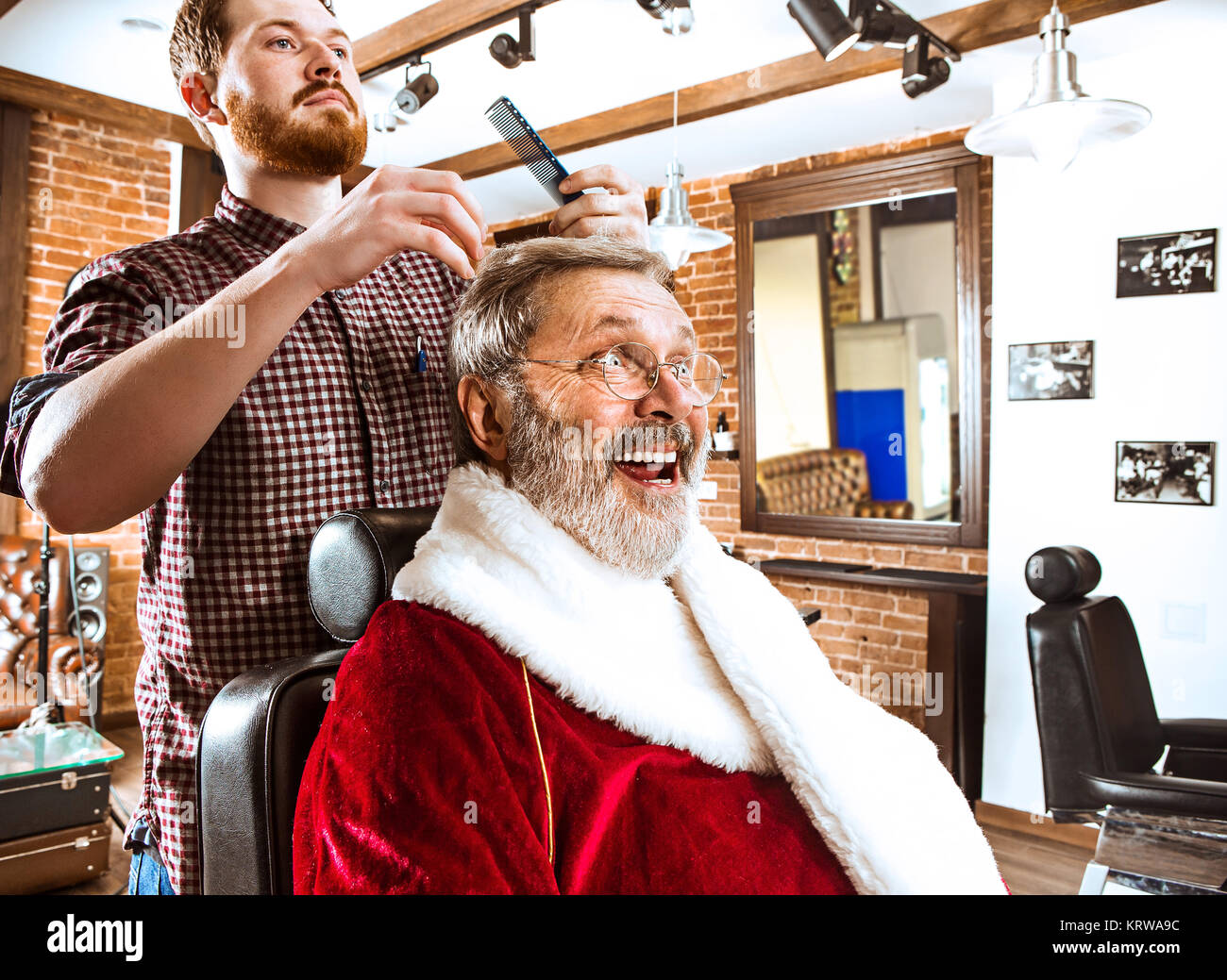 Santa claus shaving his personal barber Stock Photo - Alamy