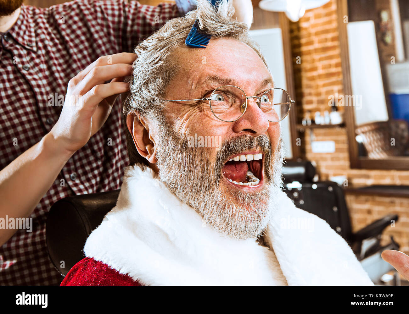Santa claus shaving his personal barber Stock Photo - Alamy