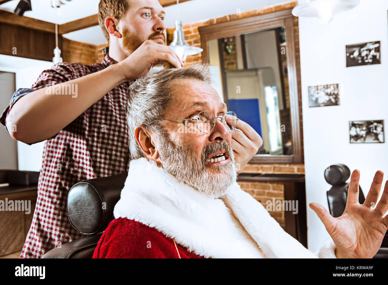 Santa claus shaving his personal barber Stock Photo - Alamy