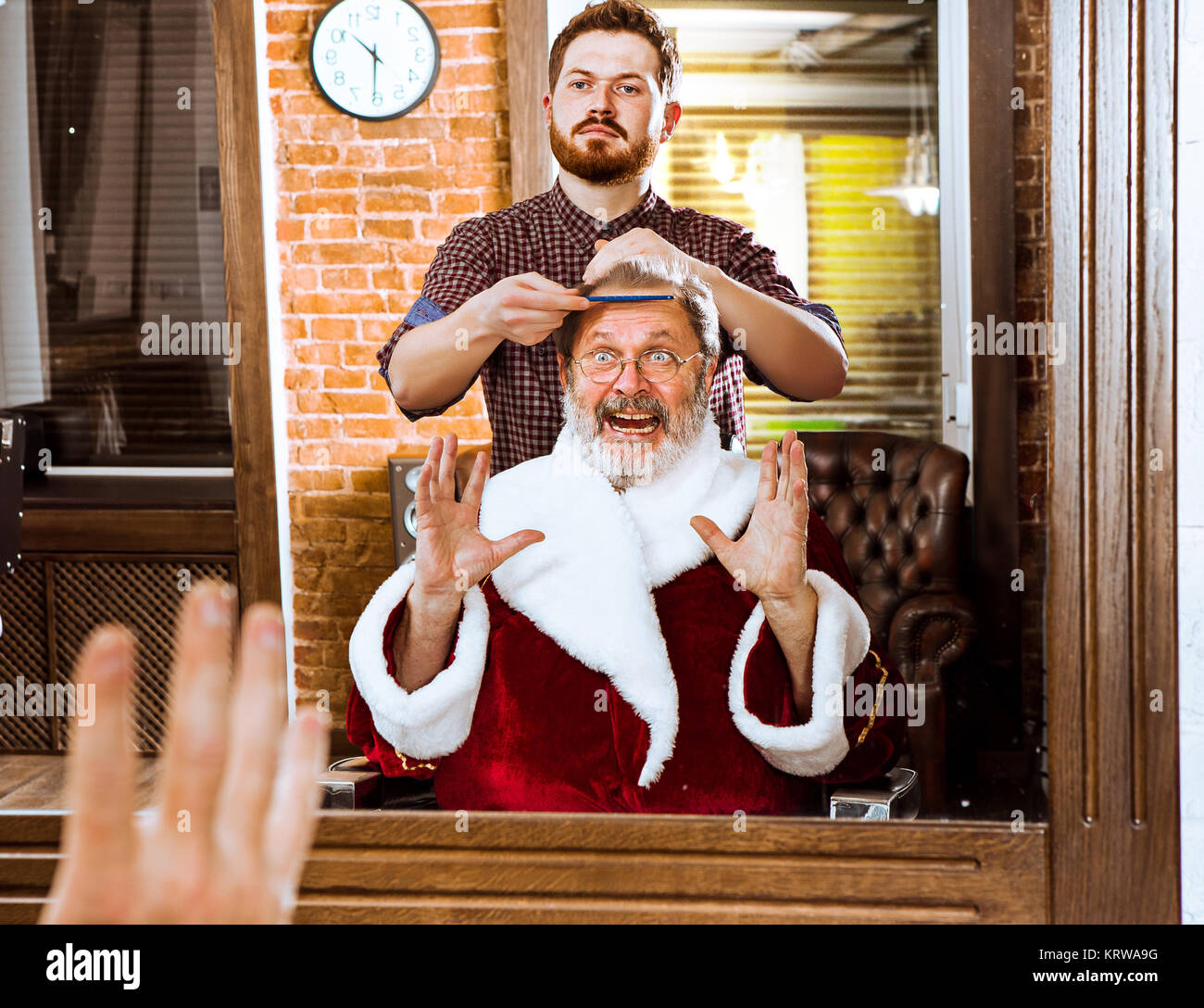 Santa claus shaving his personal barber Stock Photo - Alamy
