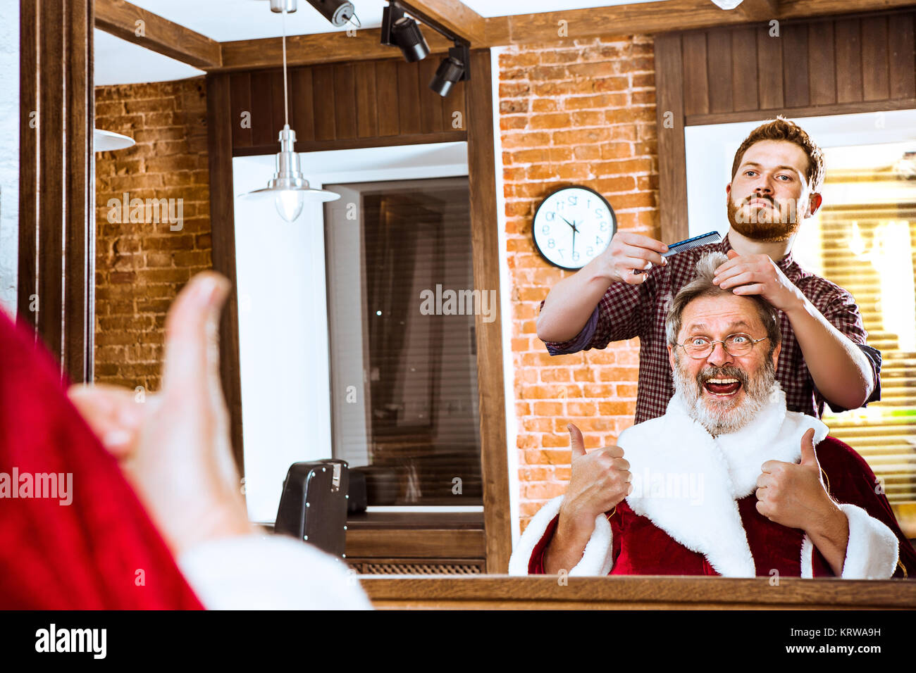 Santa claus shaving his personal barber Stock Photo - Alamy