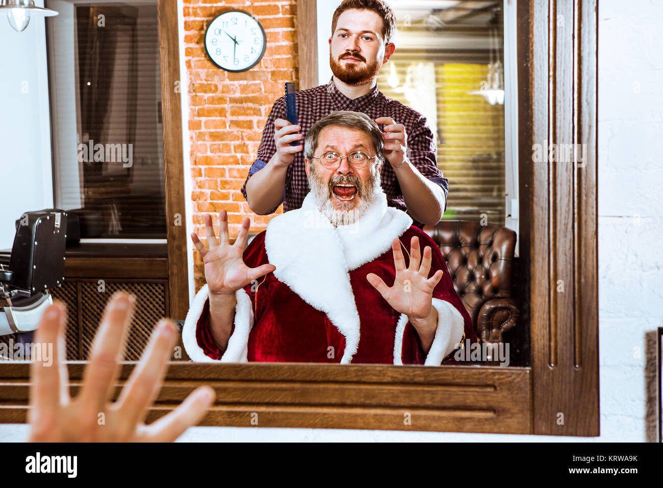 Santa claus shaving his personal barber Stock Photo - Alamy