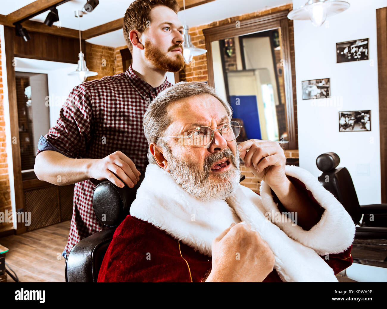 Santa claus shaving his personal barber Stock Photo - Alamy