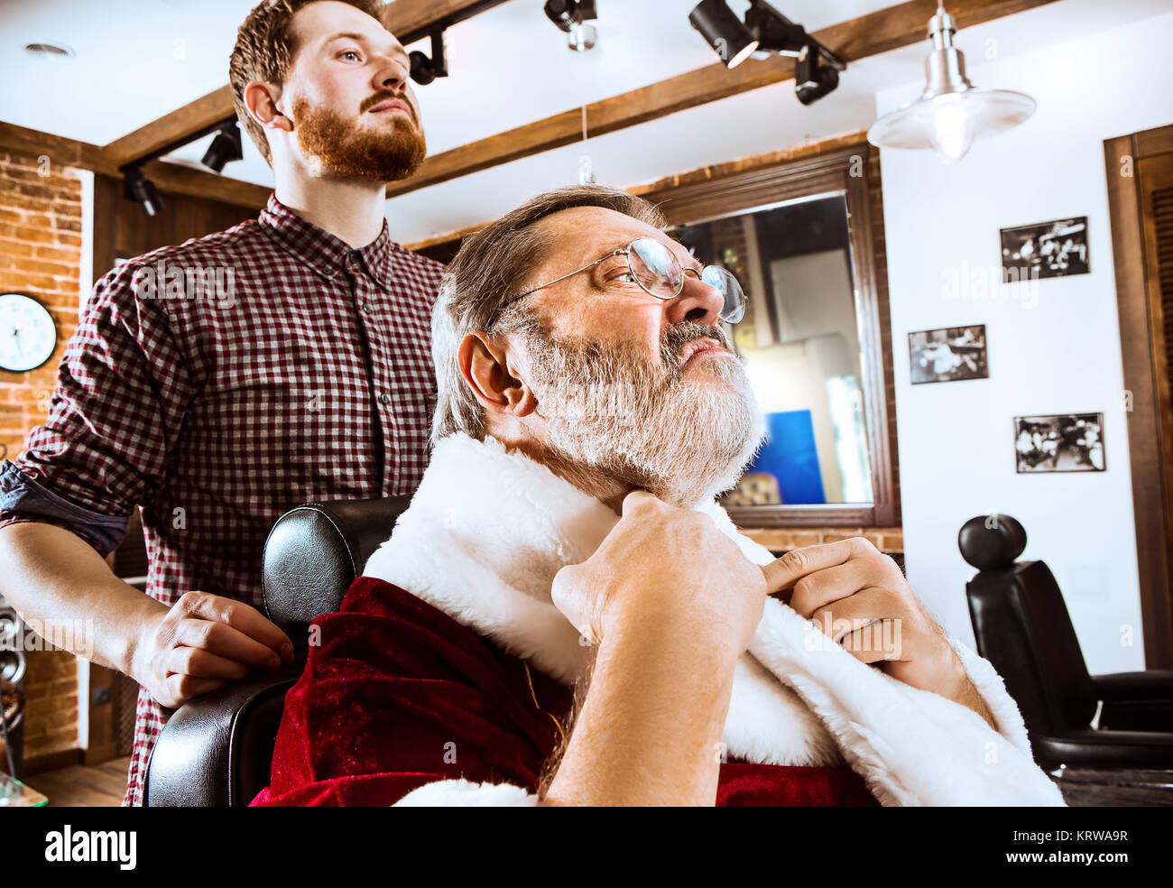 Santa claus shaving his personal barber Stock Photo - Alamy