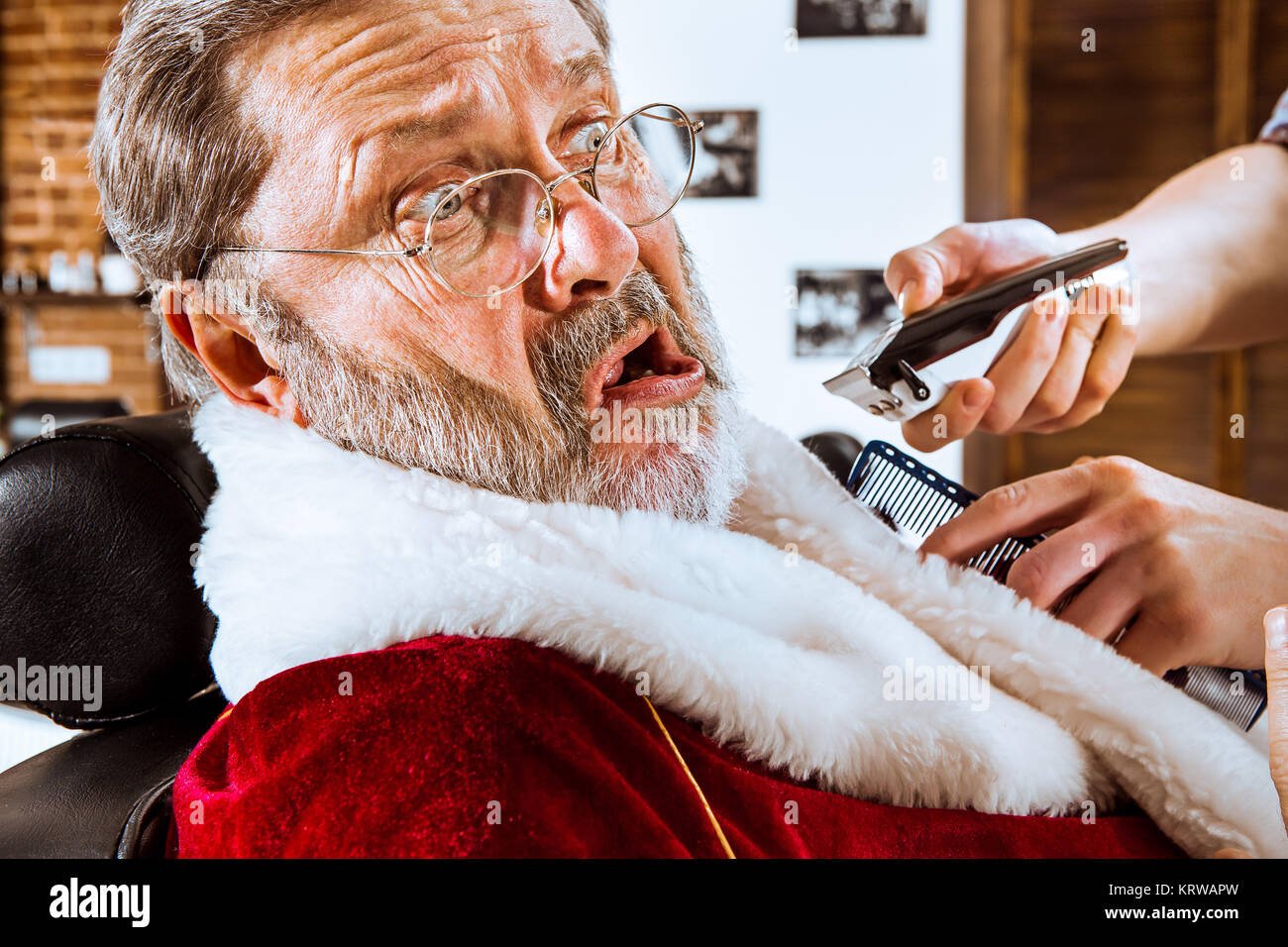 Santa claus shaving his personal barber Stock Photo - Alamy