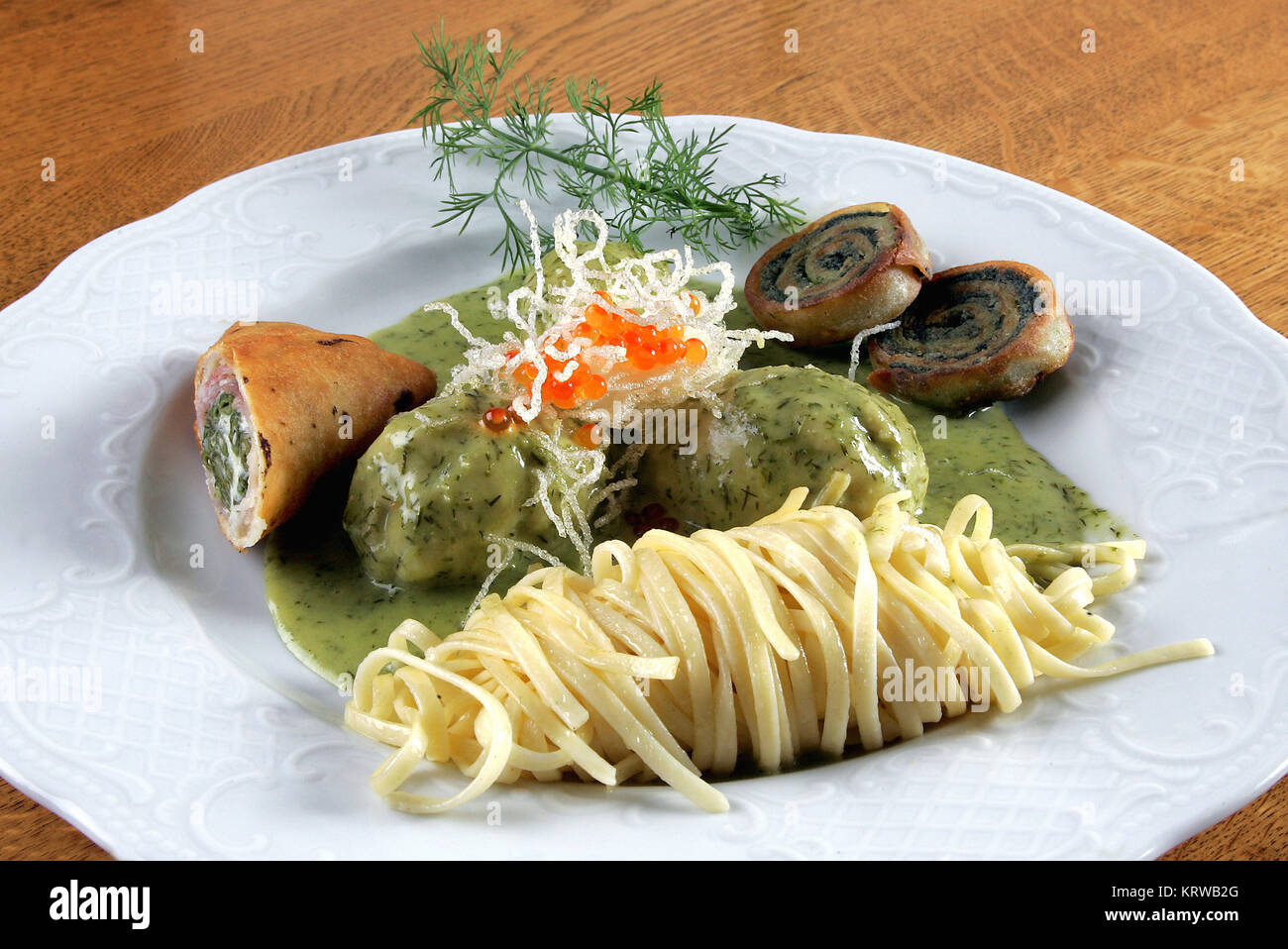 pike dumplings with bean bag and spinach rolls Stock Photo - Alamy