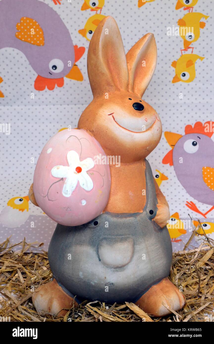 A rabbit of Easter with an egg in the leg Stock Photo - Alamy
