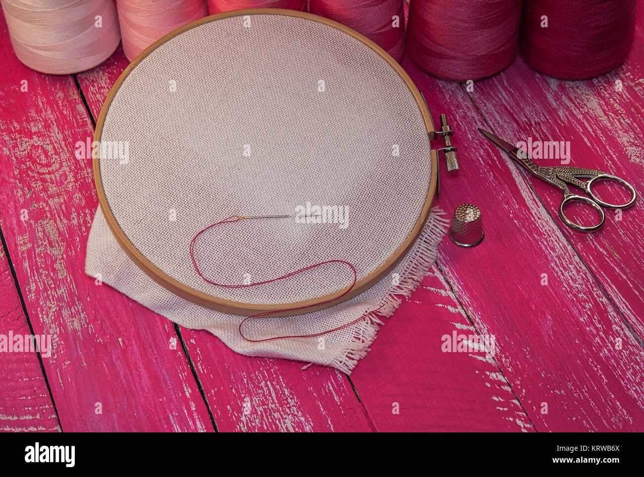 thread and fabric in the wooden embroidery frame for needlework Stock ...