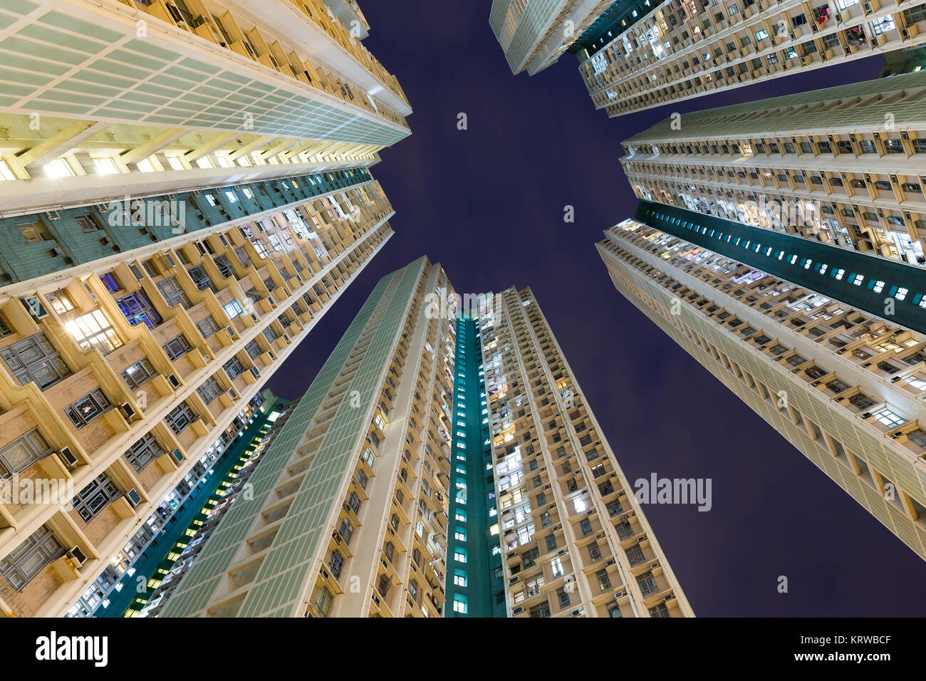 Apartment building to the sky at night Stock Photo - Alamy
