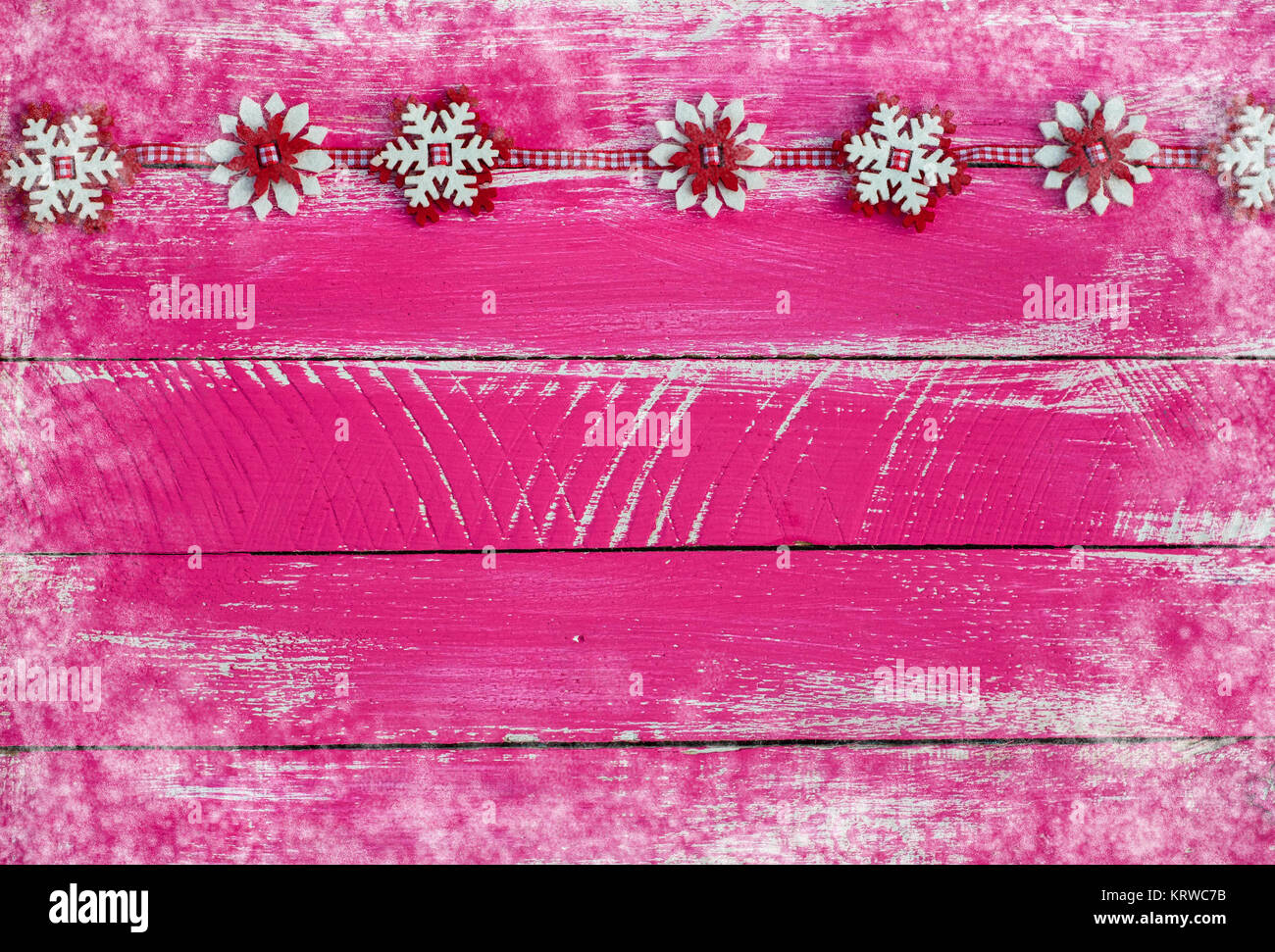 Wooden shabby pink background with garland of felt snowflakes Stock ...