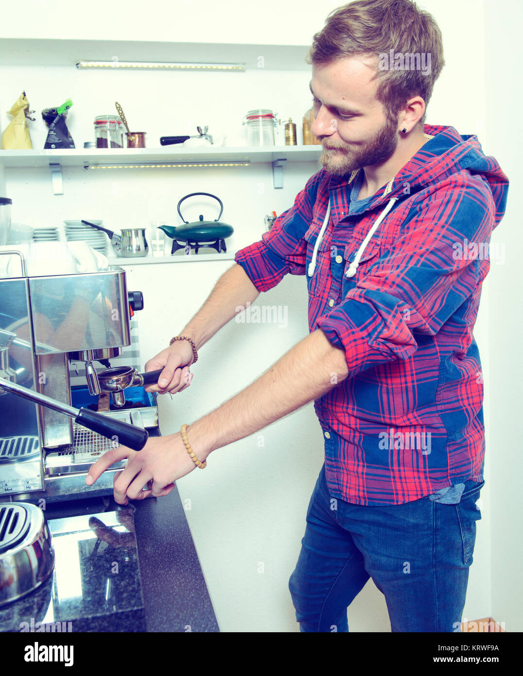 man using espresso metallic machine with portafilter Stock Photo - Alamy