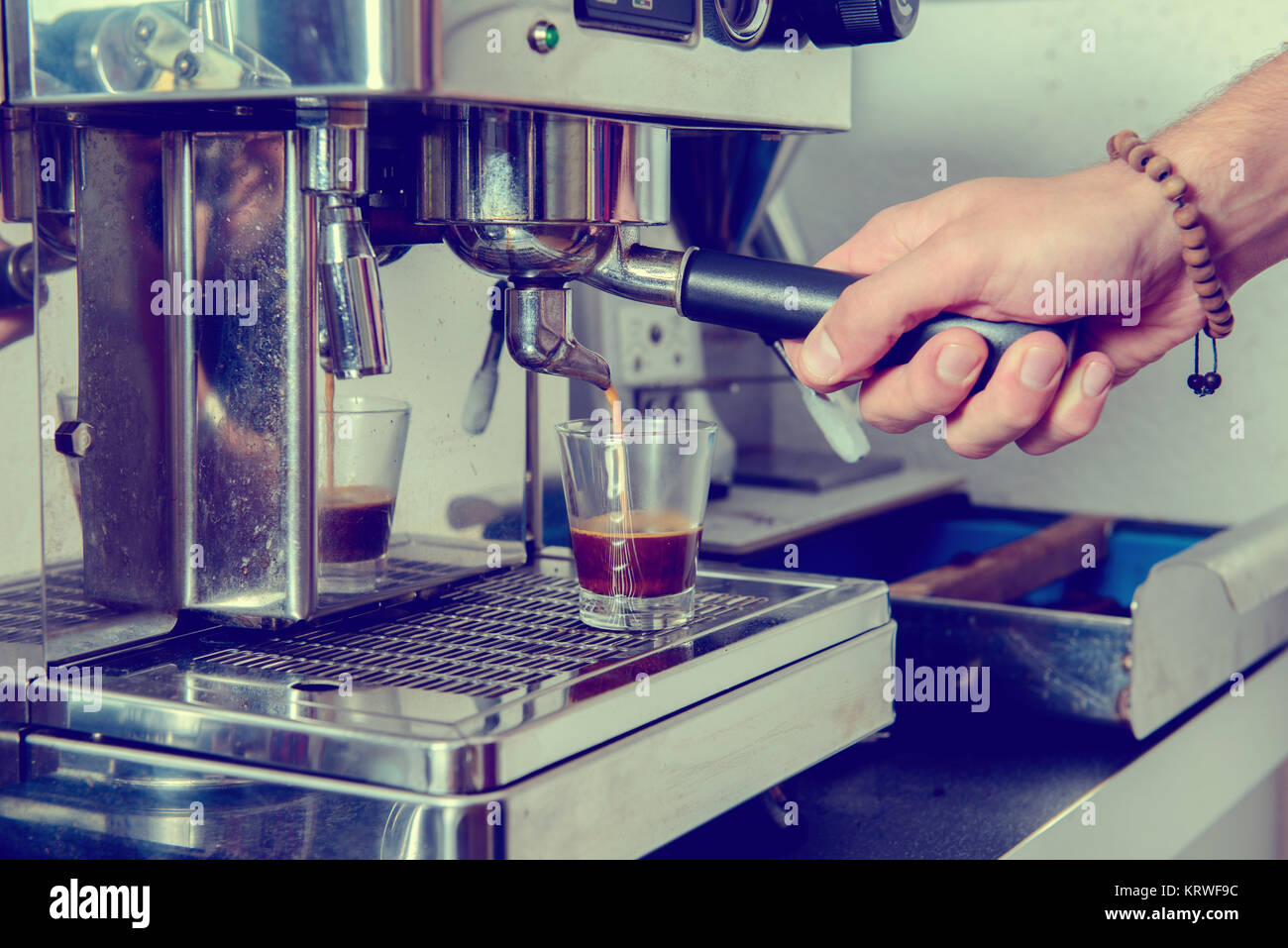 man using espresso metallic machine with portafilter Stock Photo - Alamy
