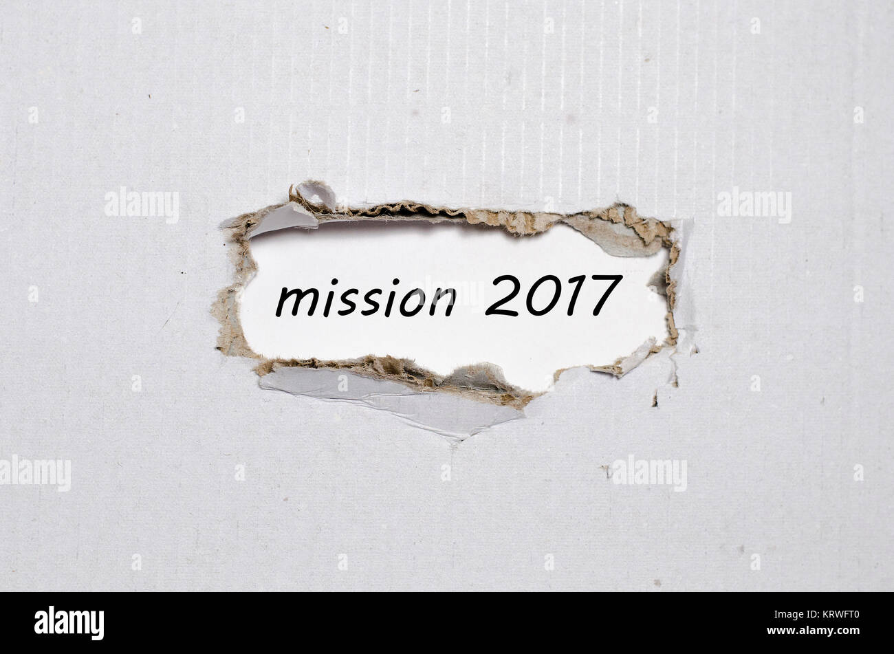 The word mission 2017 appearing behind torn paper Stock Photo - Alamy