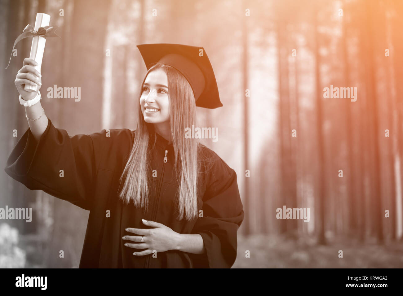 Graduation: Student Standing With Diploma Stock Photo - Alamy