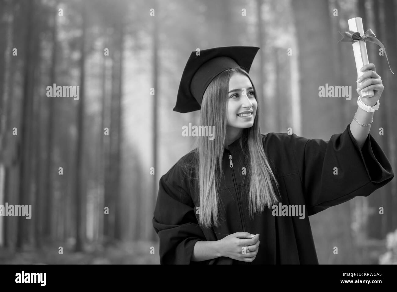 Graduation: Student Standing With Diploma Stock Photo - Alamy