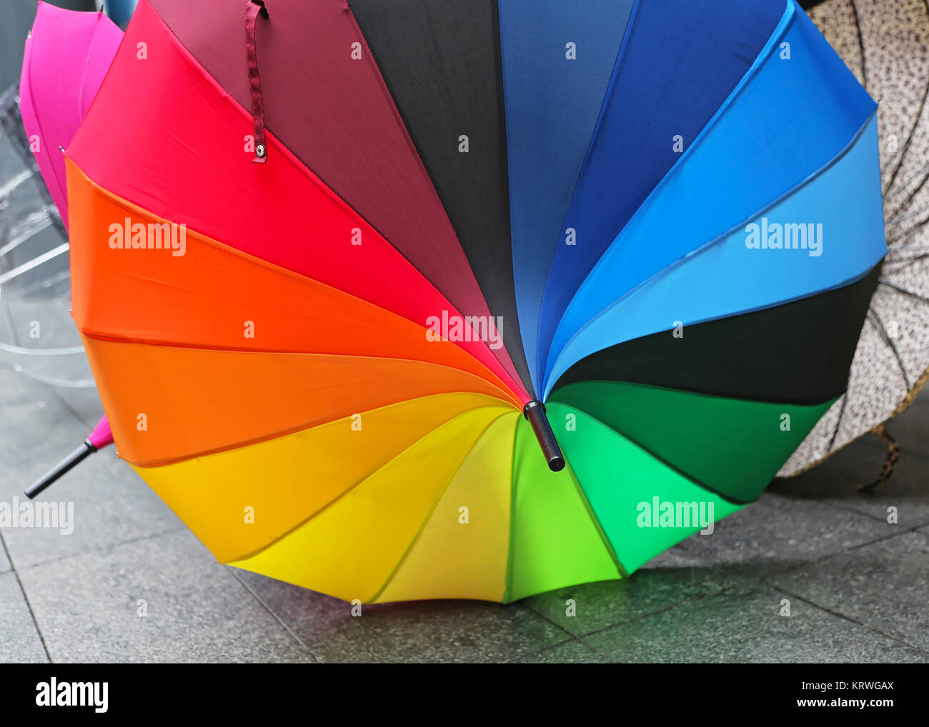 Rainbow parasol hi-res stock photography and images - Alamy