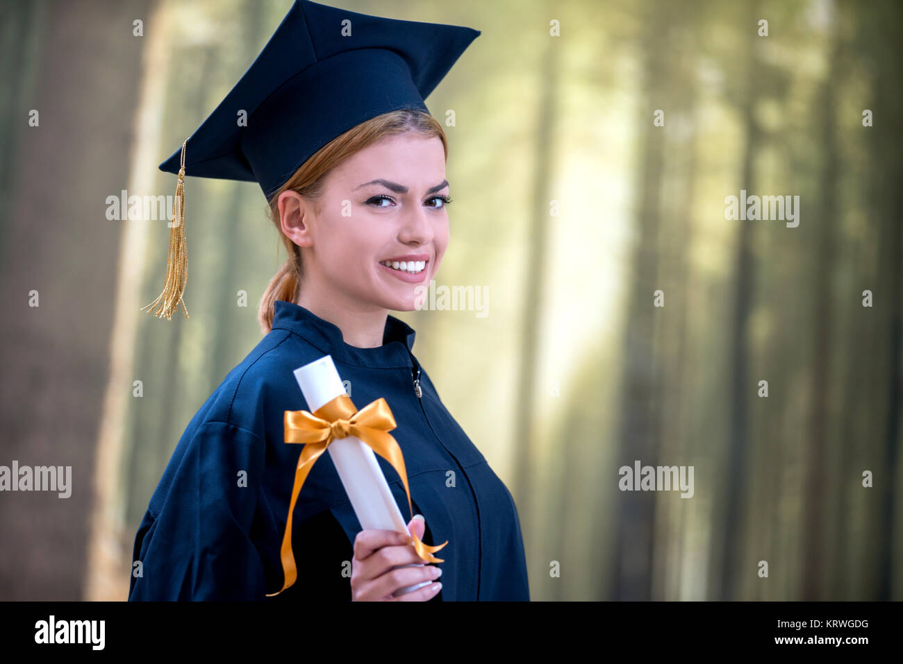 Graduation: Student Standing With Diploma Stock Photo - Alamy