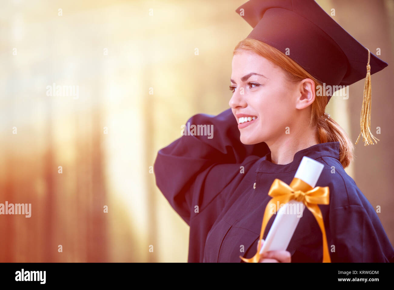 Graduation: Student Standing With Diploma Stock Photo - Alamy