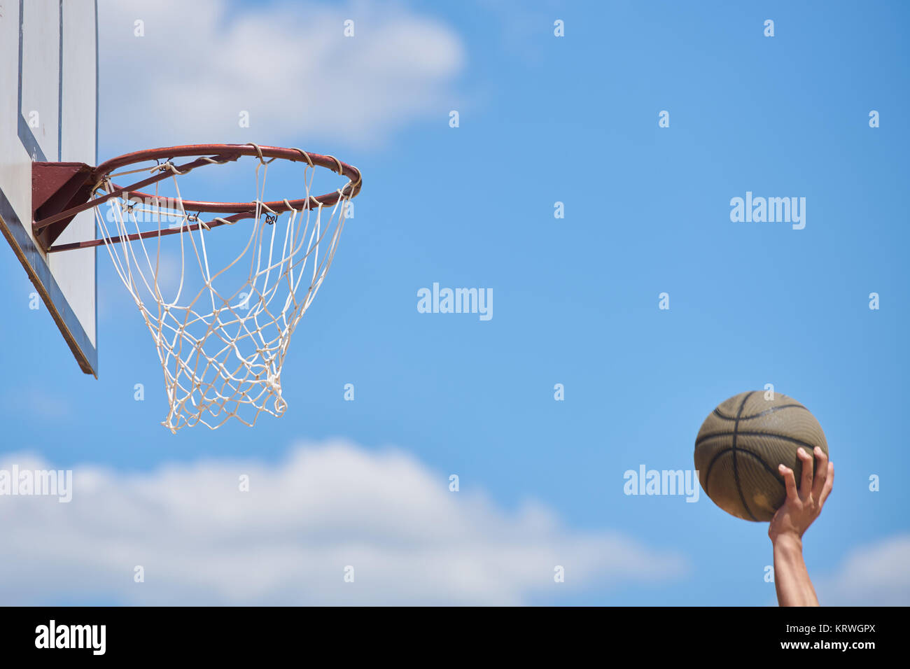Basketball player in action flying high and scoring Stock Photo - Alamy
