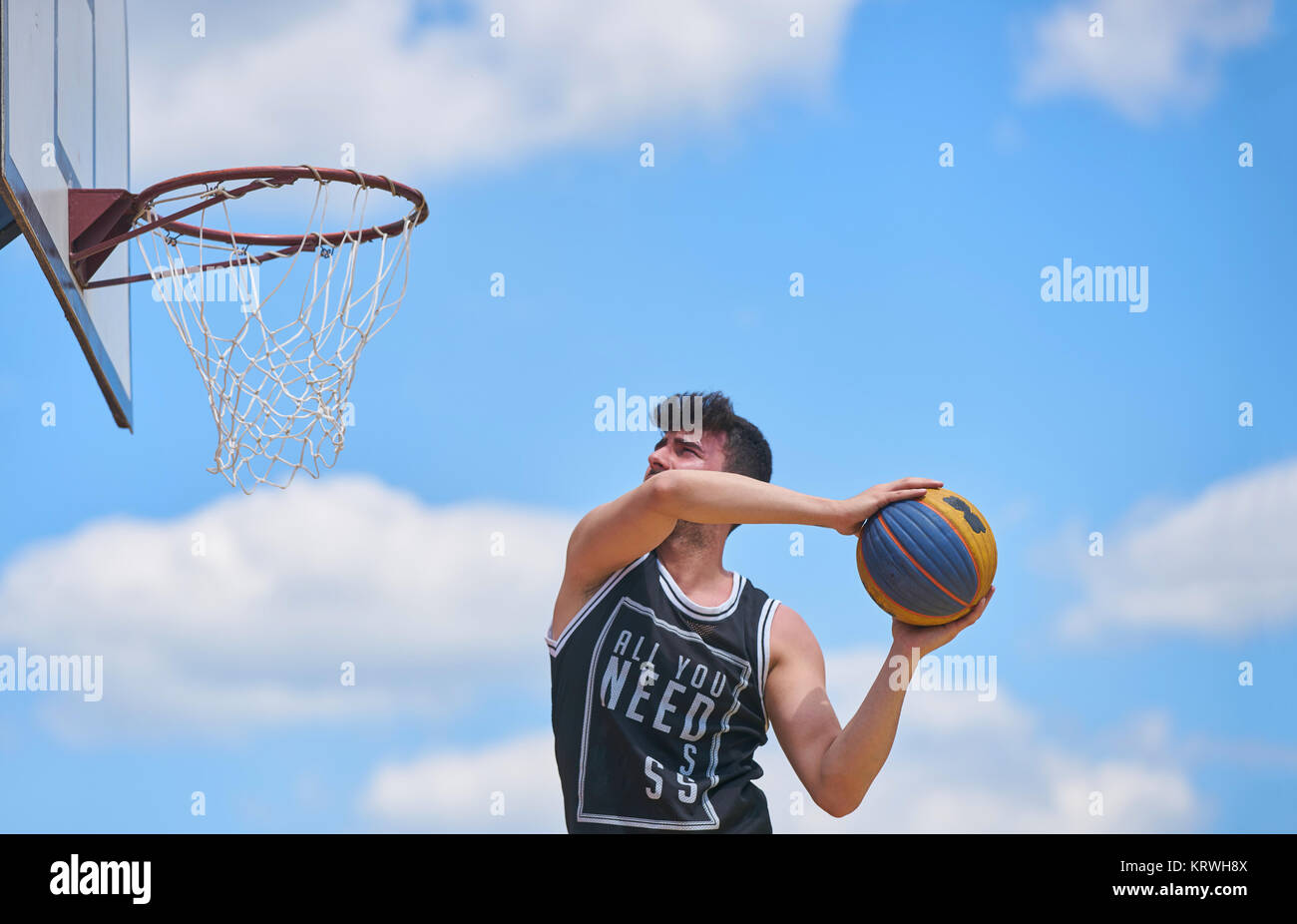 Basketball player in action flying high and scoring Stock Photo - Alamy