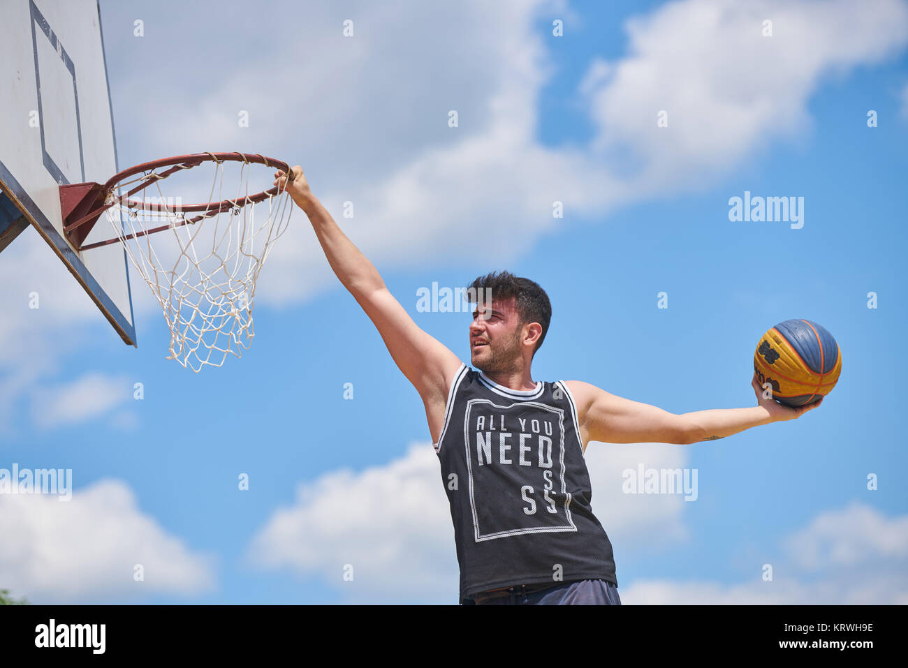 Basketball player in action flying high and scoring Stock Photo - Alamy