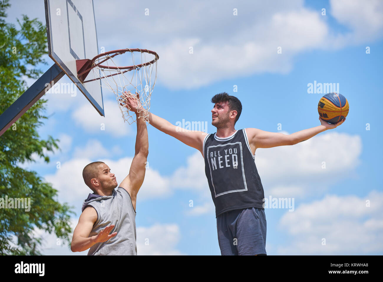 Basketball player in action flying high and scoring Stock Photo - Alamy