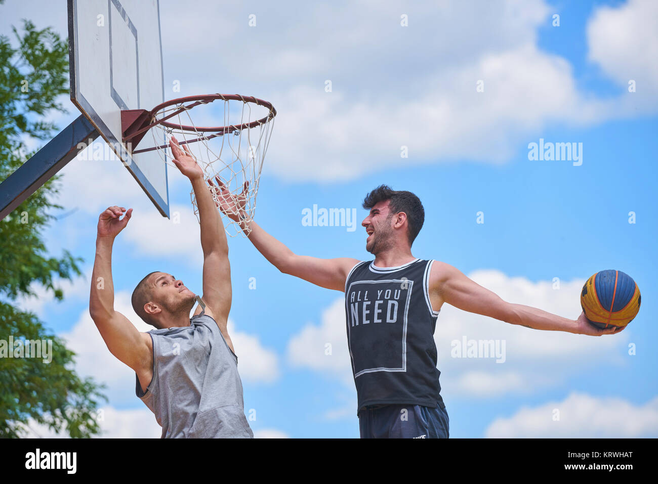 Basketball player in action flying high and scoring Stock Photo - Alamy