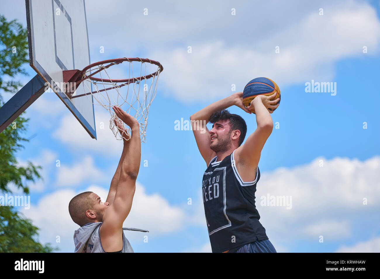 Basketball player in action flying high and scoring Stock Photo - Alamy