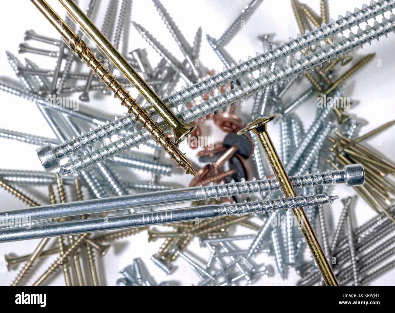 lots of screws, bolts and washers in light back Stock Photo - Alamy