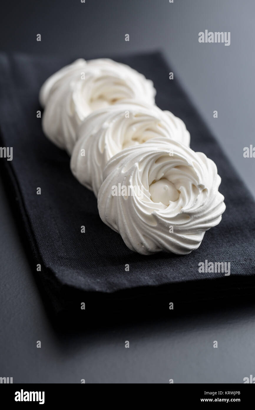 Sweet white meringue Stock Photo - Alamy