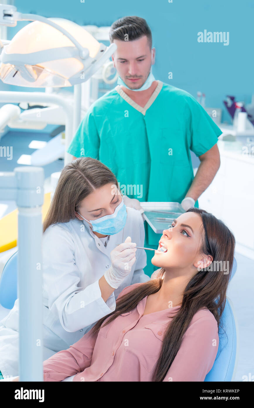 Doctor talking with her patient. Dentist concept Stock Photo - Alamy