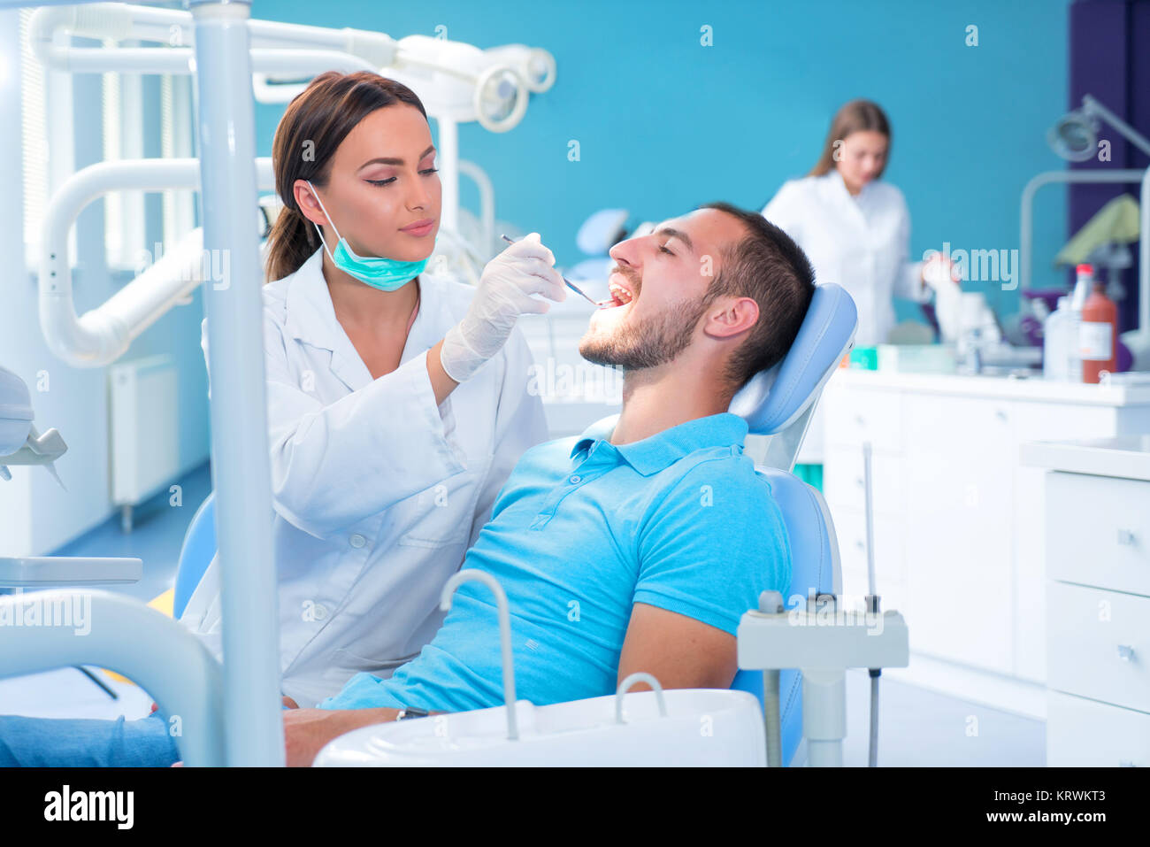 Doctor talking with her patient. Dentist concept Stock Photo - Alamy