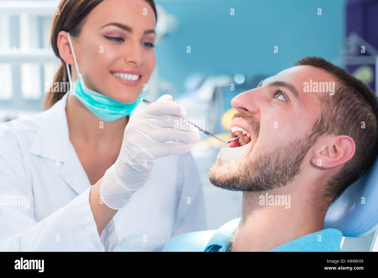 Doctor talking with her patient. Dentist concept Stock Photo - Alamy