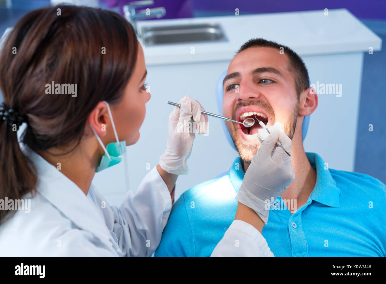 Doctor talking with her patient. Dentist concept Stock Photo - Alamy