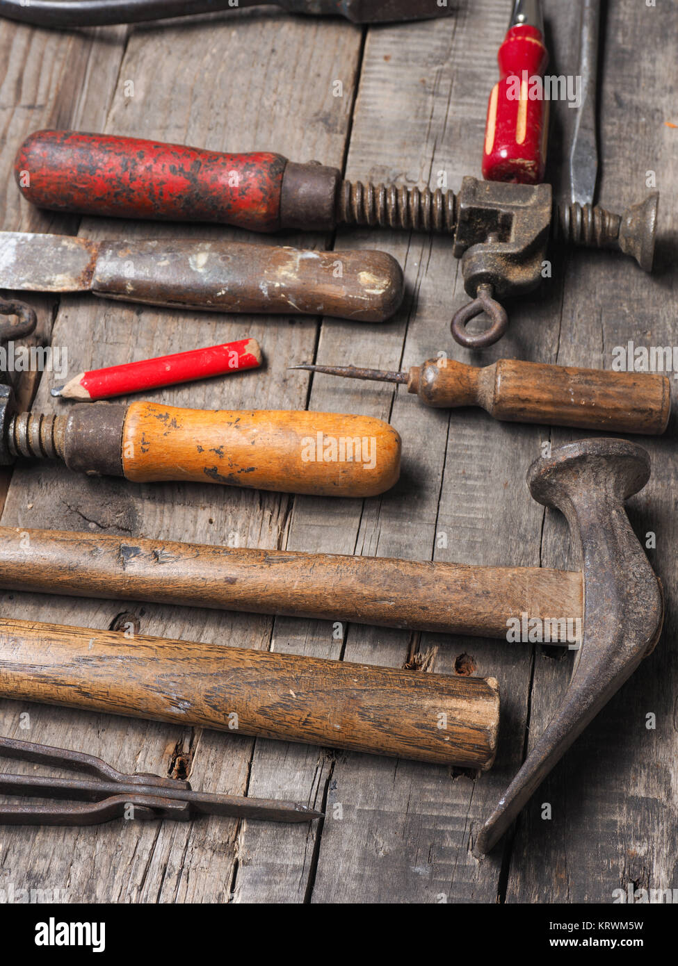 Old rusty tools on a used workbench, industrial background Stock Photo ...
