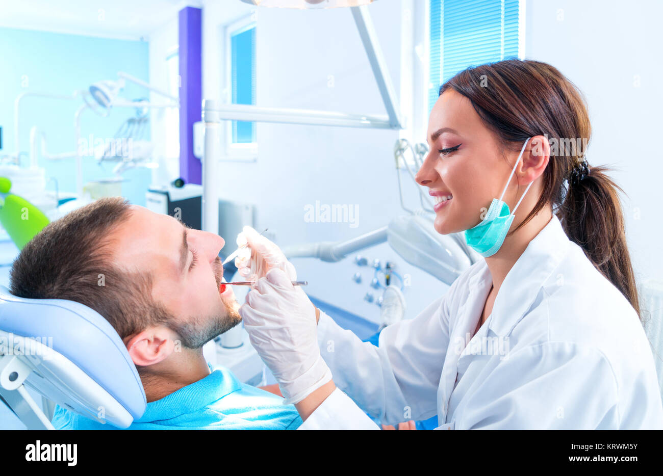 Doctor talking with her patient. Dentist concept Stock Photo - Alamy