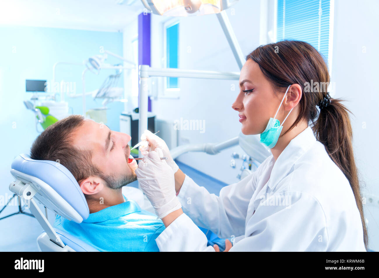 Doctor talking with her patient. Dentist concept Stock Photo - Alamy