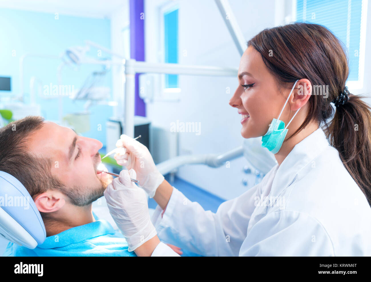 Doctor talking with her patient. Dentist concept Stock Photo - Alamy