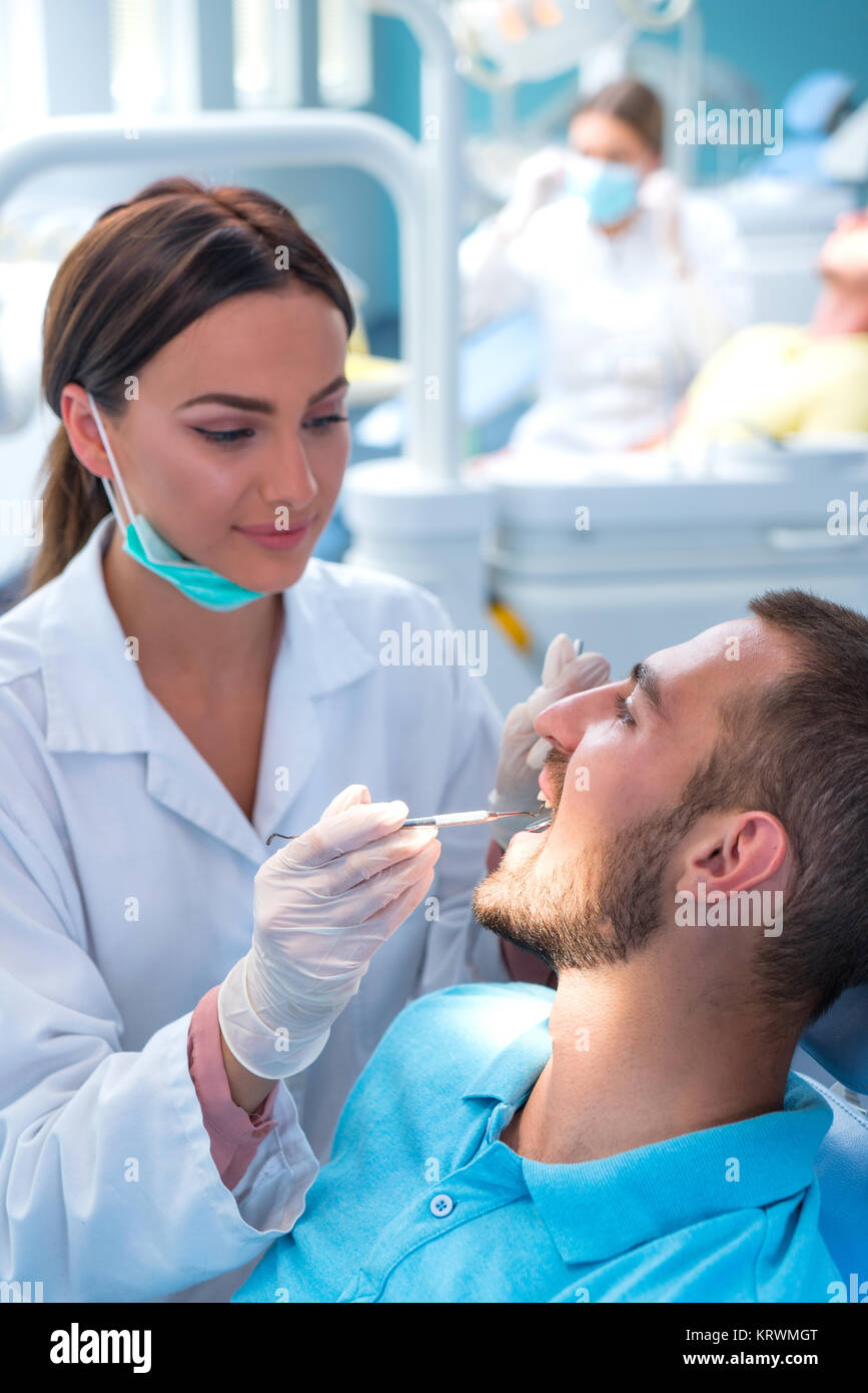 Doctor talking with her patient. Dentist concept Stock Photo - Alamy