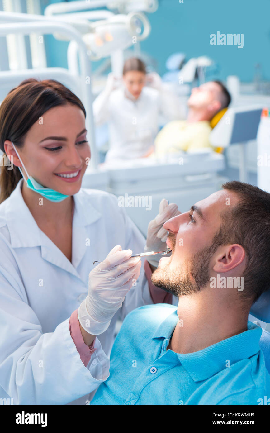 Doctor talking with her patient. Dentist concept Stock Photo - Alamy
