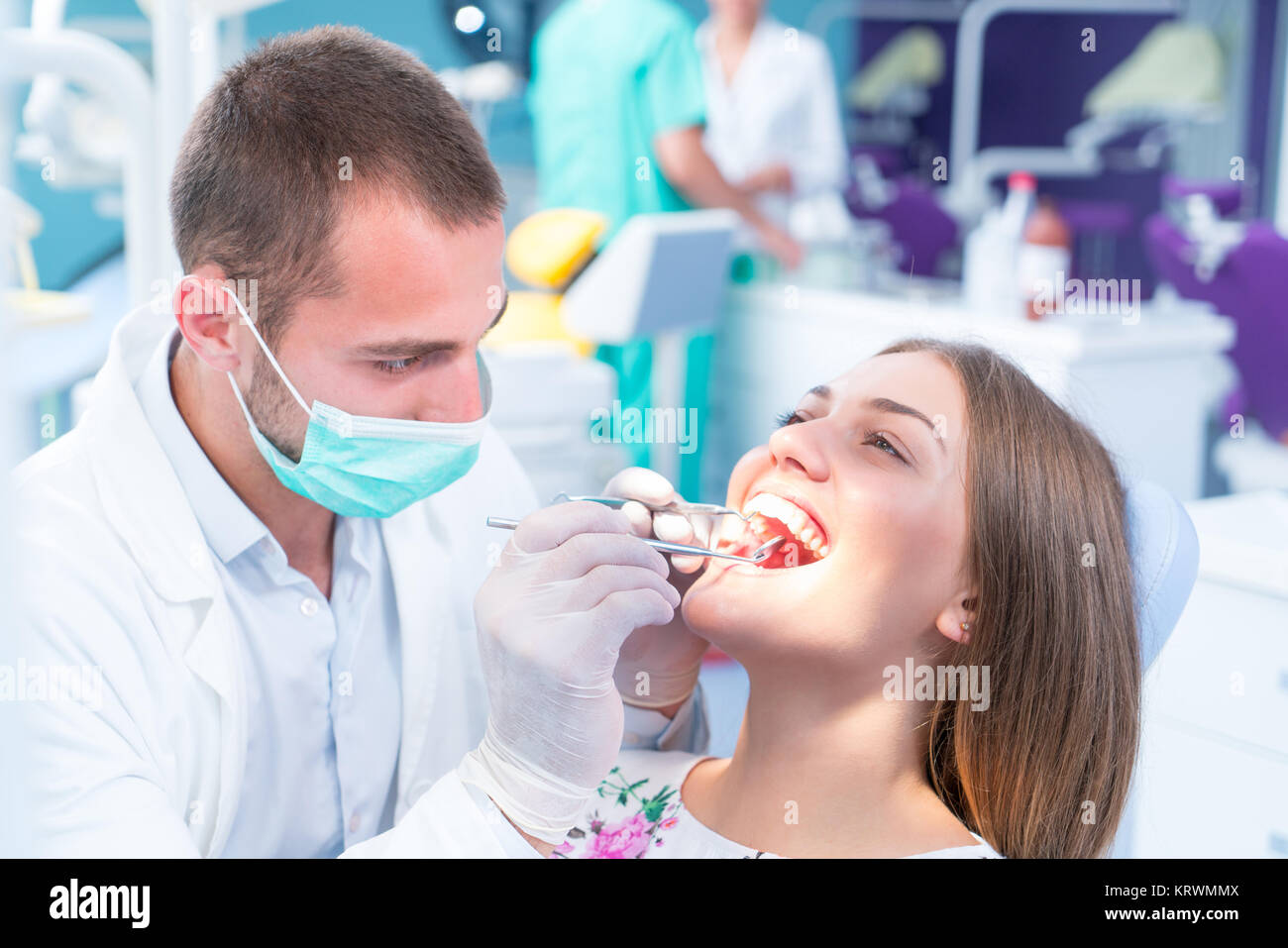 Doctor talking with her patient. Dentist concept Stock Photo - Alamy
