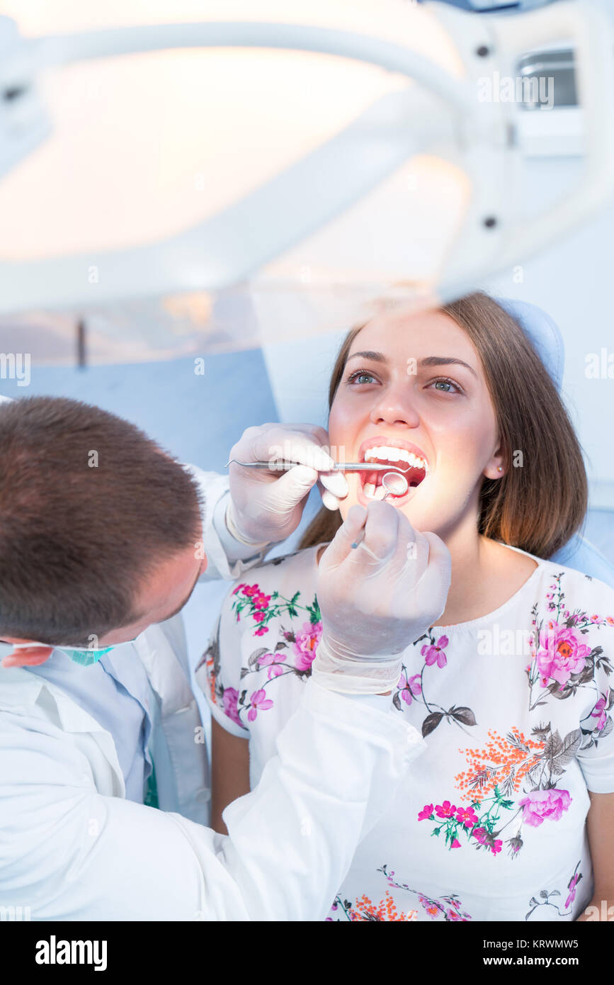 Doctor talking with her patient. Dentist concept Stock Photo - Alamy