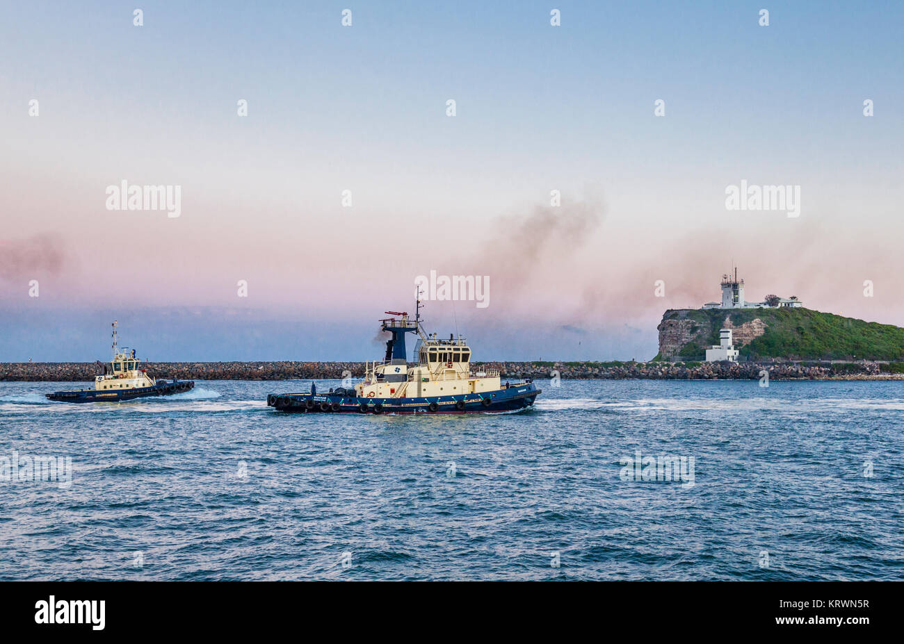 Tug boats Wickham and Svitzer Hamilton at Nobbys Head returning to ...